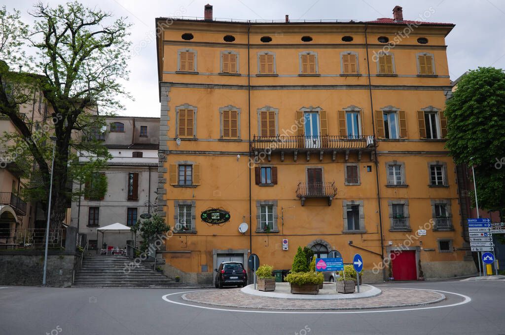 Borgo Val di Taro, Italy - May, 2022: Old multi-storey yellow building ...