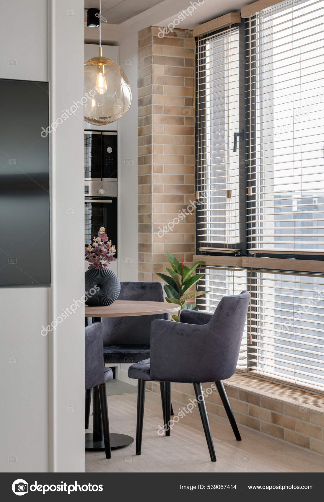 Coffee table with candles by the window of the hung blinds Stock Photo ...
