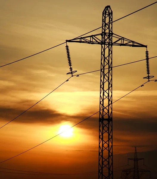 High power electric line towers at dramatic sunset background - Stock ...