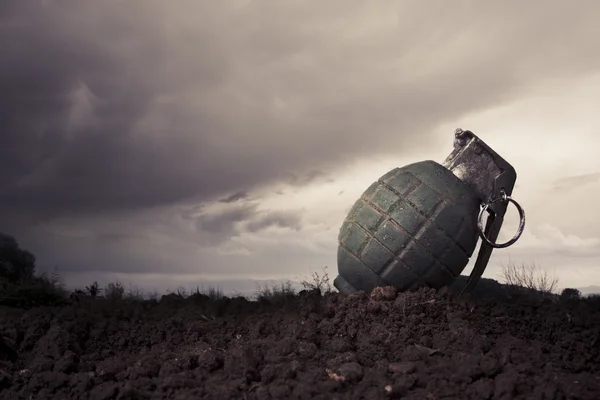 Green grenade on a battlefield at dusk Stock Photo by ©fergregory 12283264