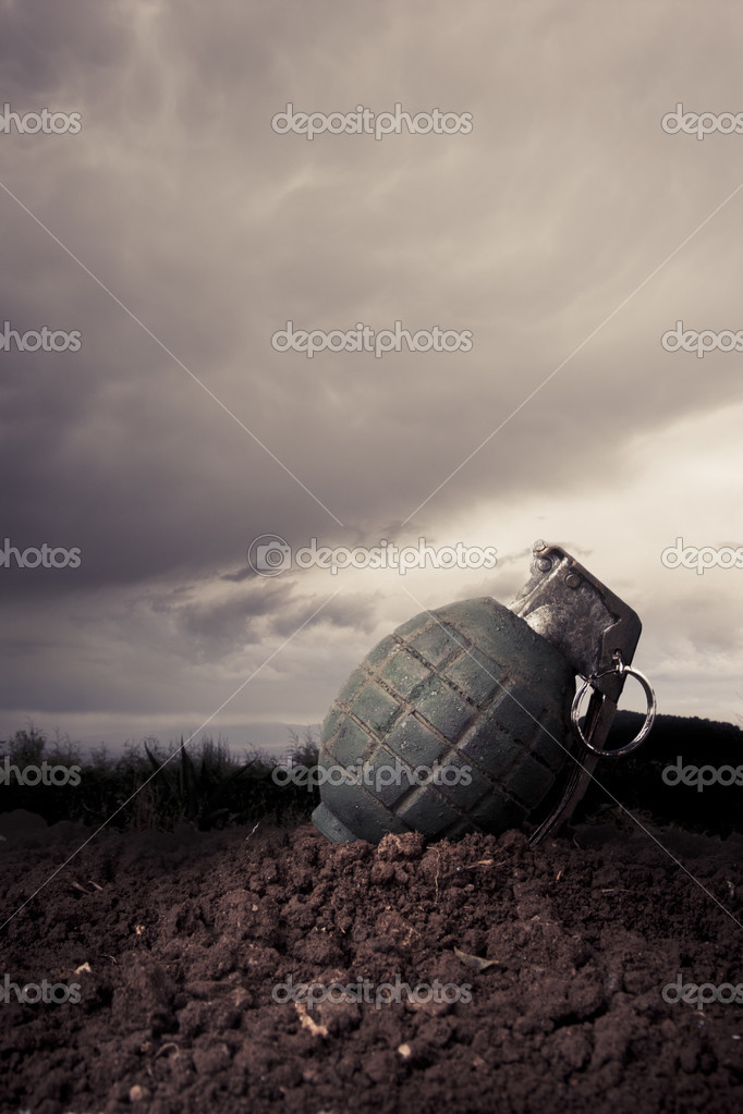 Green grenade on a battlefield at dusk Stock Photo by ©fergregory 12283264
