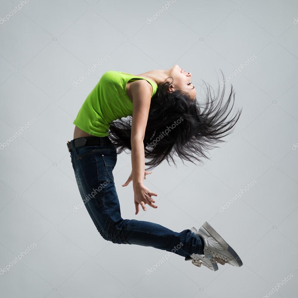 Beautiful caucasian woman dancer jumping Stock Photo by ©Artranq 42336073