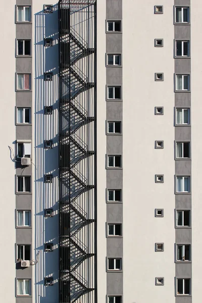 Fire escape ladders and staircases outside a high-rise residential ...
