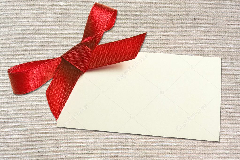 Blank gift tag tied with a bow of red satin ribbon. — Stock Photo ...