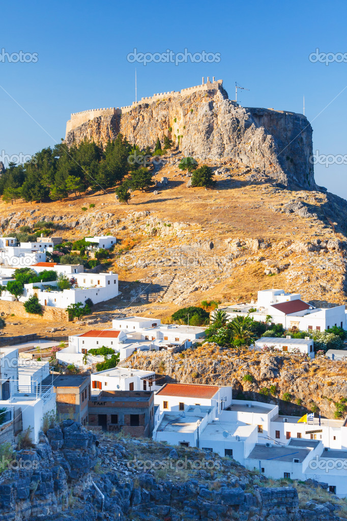 Lindos, castle above on the Greek Island of Rhodes Stock Photo by ...