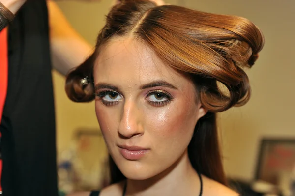LOS ANGELES - OCTOBER 19: Model get ready backstage for Swim Fashion ...
