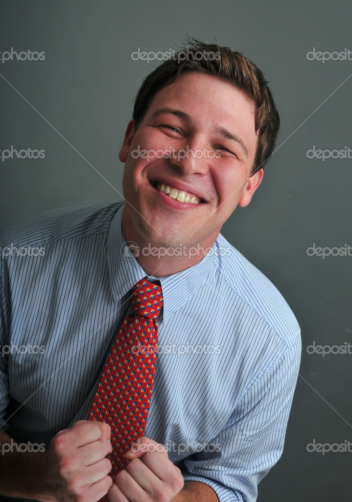 Young male actor making emotional facial expression in front of camera ...