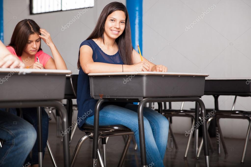 Cute girl taking a test at school Stock Photo by ©tonodiaz 48453479