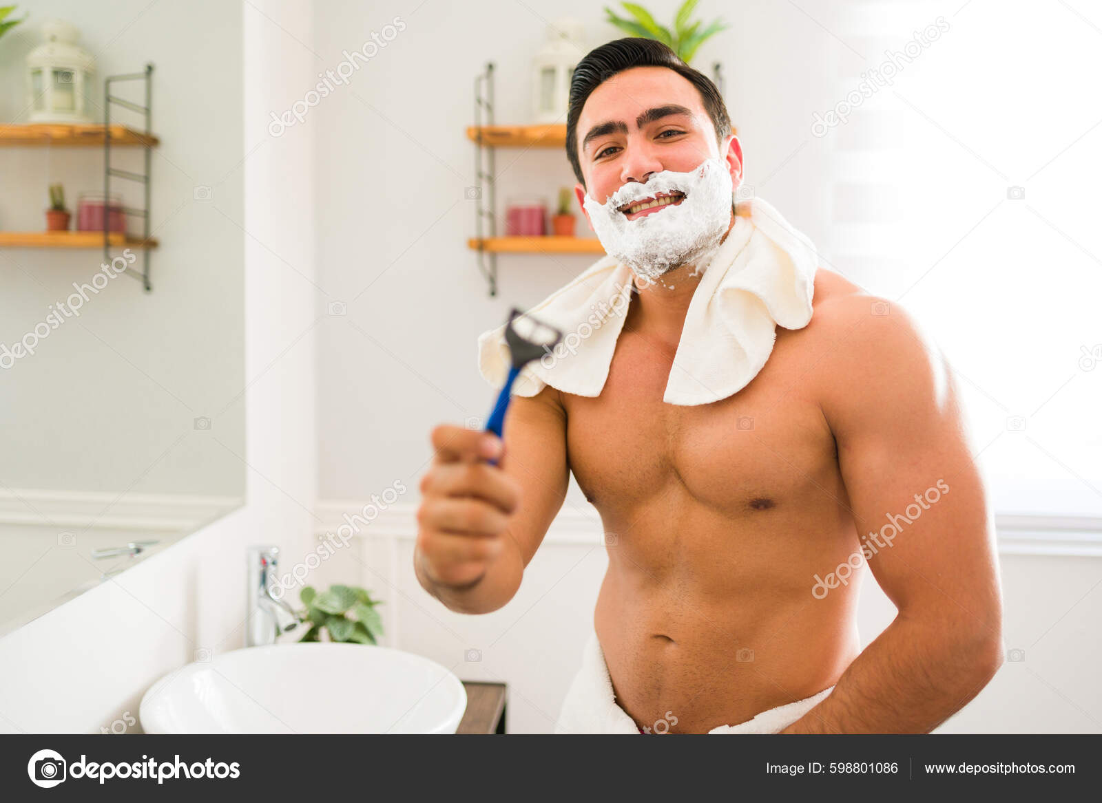 Cheerful Muscular Man Shaving Cream His Face Using Disposable Razor — Stock Photo © tonodiaz ...