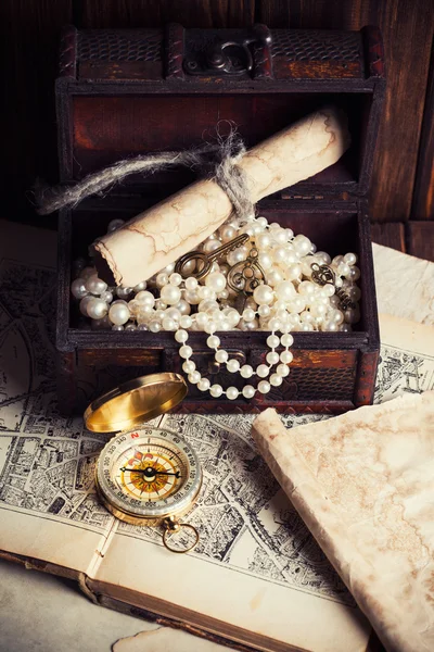 Treasure chest, compass and old map Stock Photo by ©merrydolla 48875369