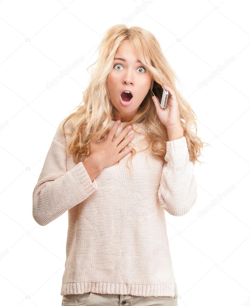Shocked young woman talking on phone on white. Stock Photo by ©kyolshin ...