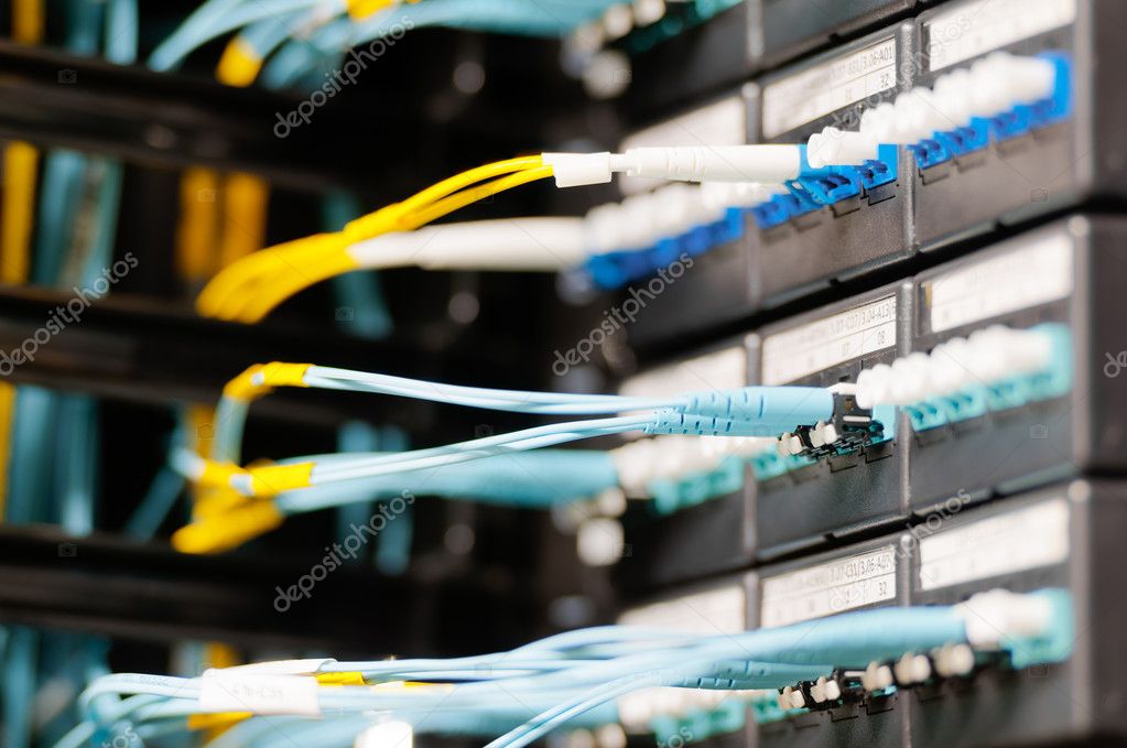 Optic cables connected to panel in server room. — Stock Photo ...