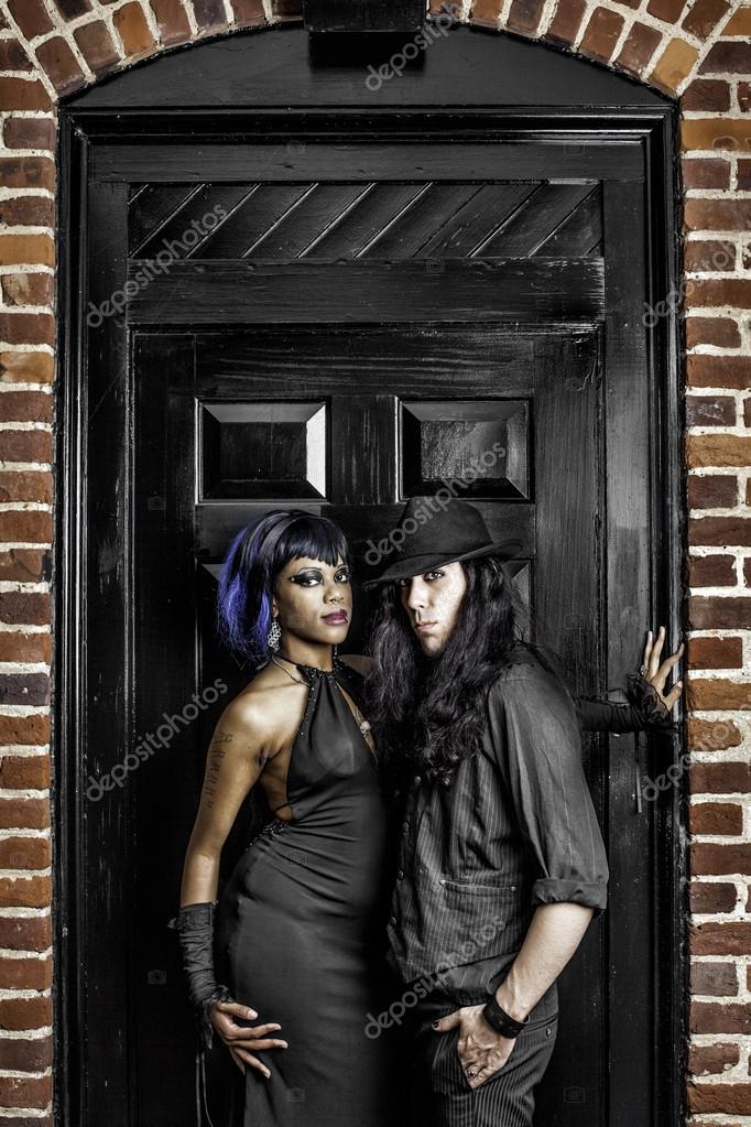 Gothic couple in front of door — Stock Photo © jminso #19104099