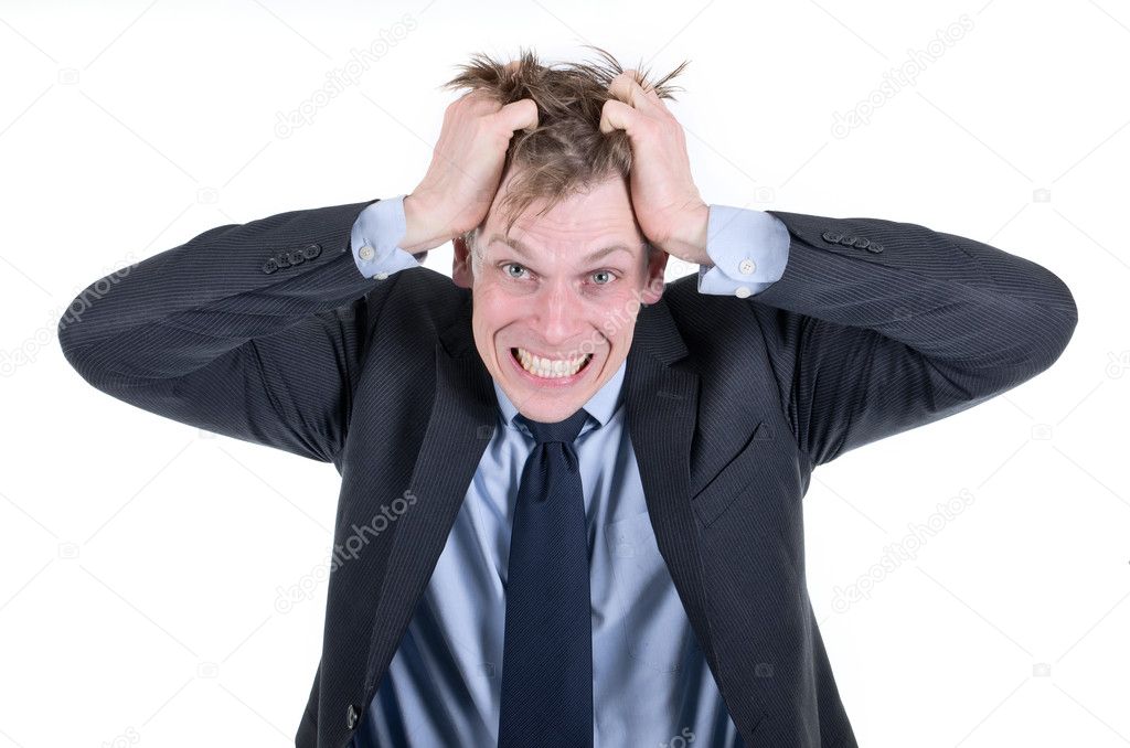 Stressed businessman pulling his hair Stock Photo by ©Mactrunk 23585819