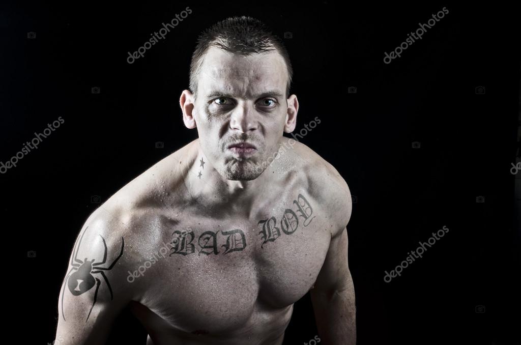 Angry muscular man Stock Photo by ©Mactrunk 26013465