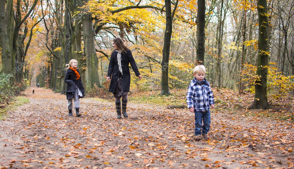 Kids playing in forest Stock Photo by ©Mactrunk 37572337