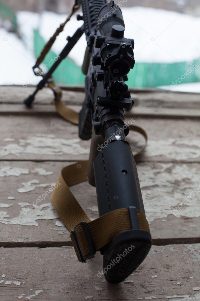 US Spec Ops M4A1 on the background of the destroyed window Stock Photo ...