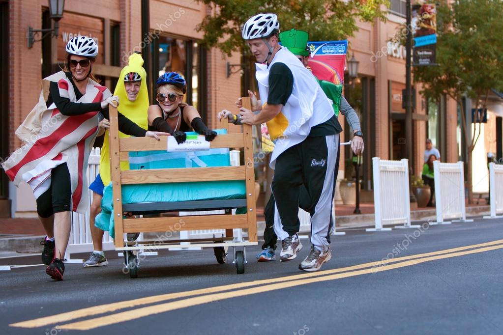 Racers Laugh While Pushing Bed In Odd Mattress Race – Stock Editorial ...