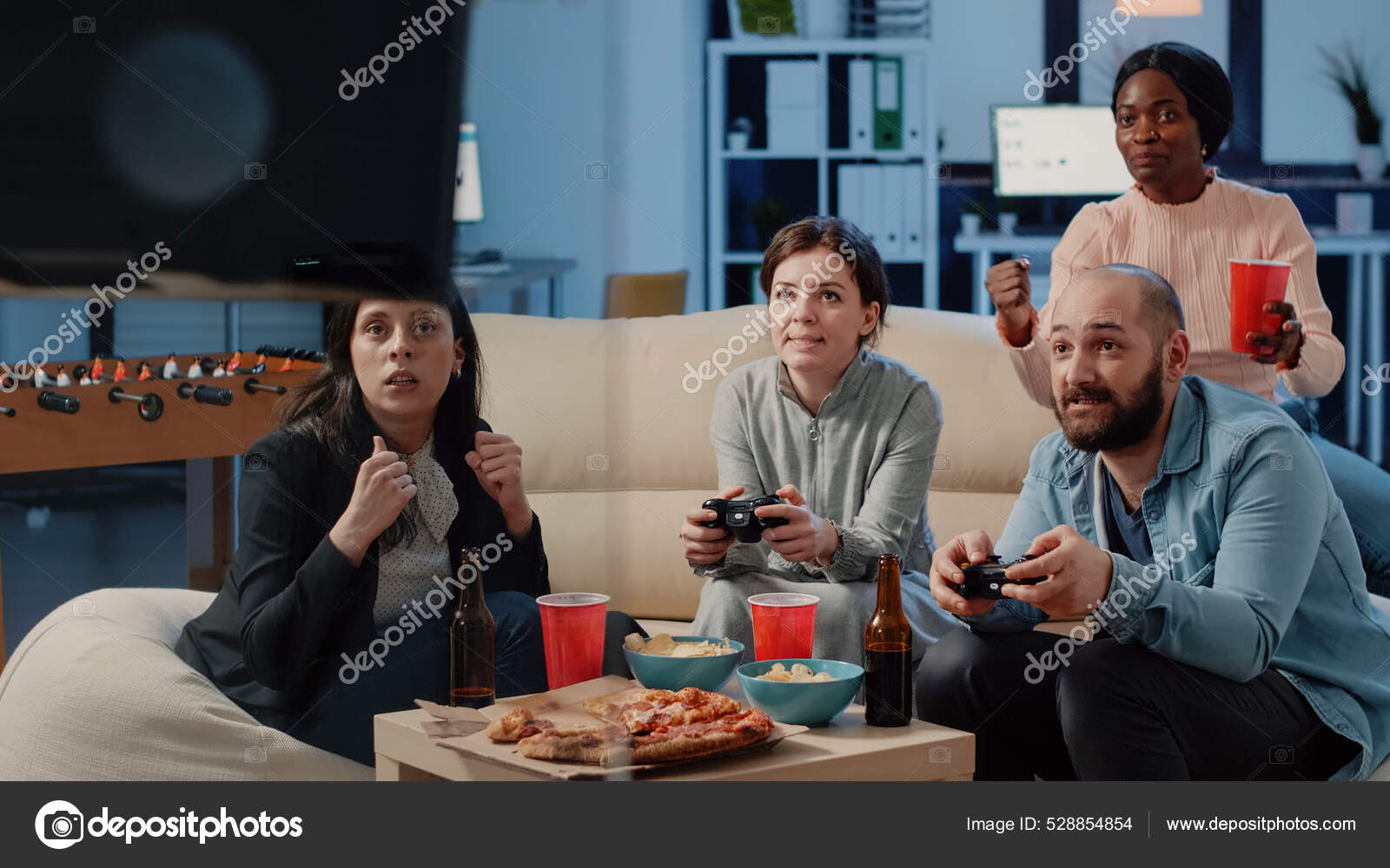 Coworkers playing video games with joysticks and losing — Stock Photo ...