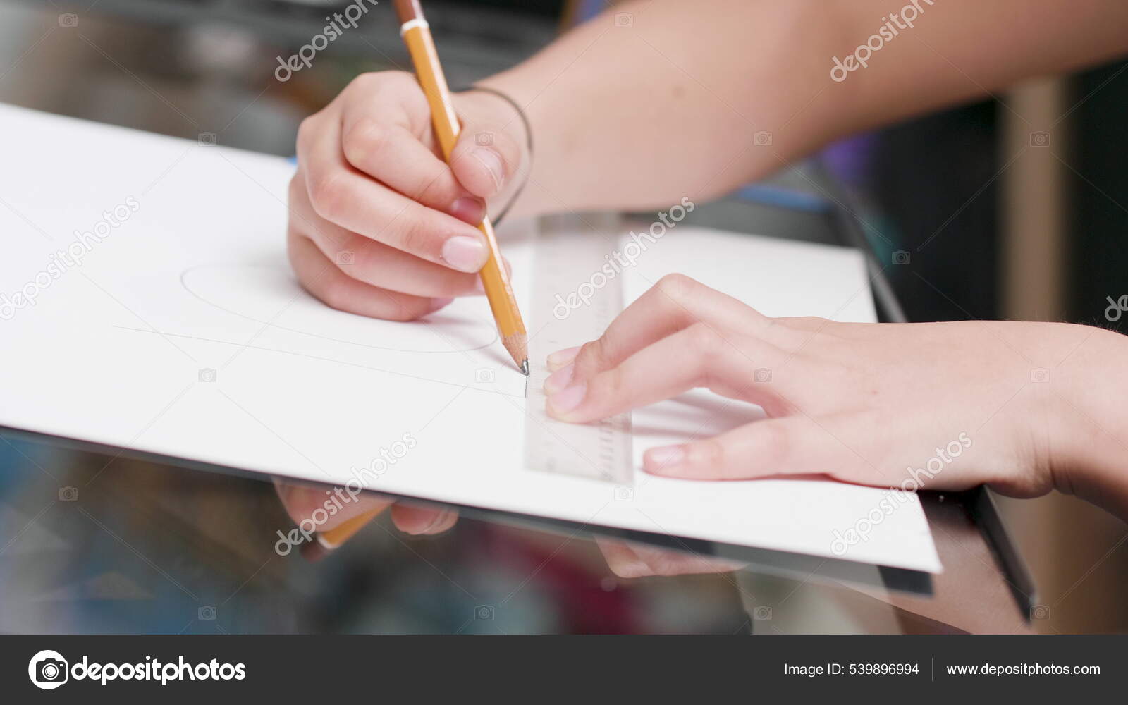 Close-up of young creative artist hand sketching on paper using graphic ...