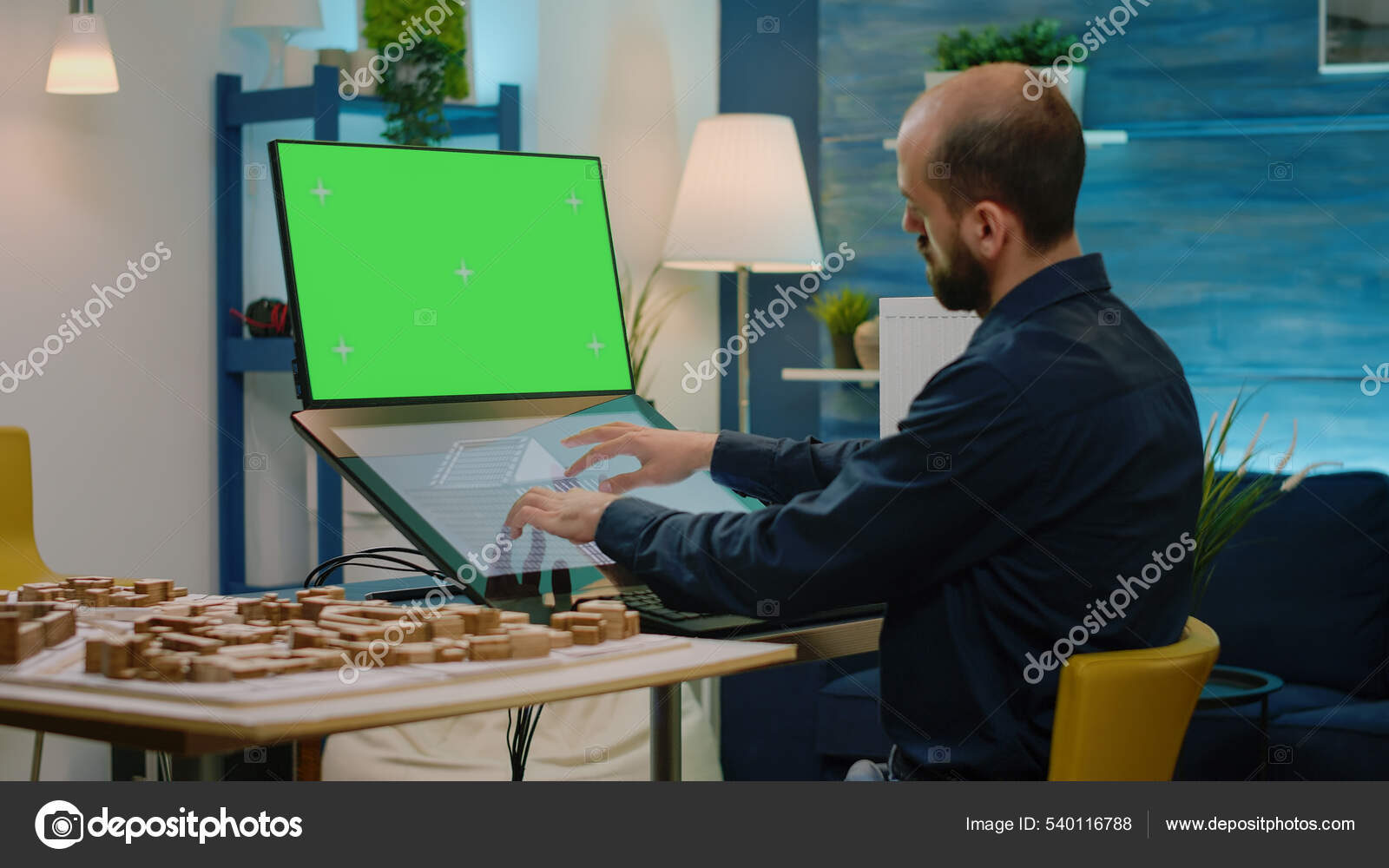 Architect using horizontal green screen and building model Stock Photo ...