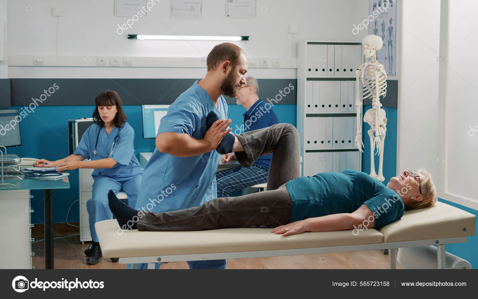 Elder person raising legs to stretch muscles in osteopathy cabinet ...