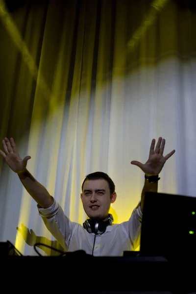 Happy disc jockey performing at a party - Stock Image - Everypixel
