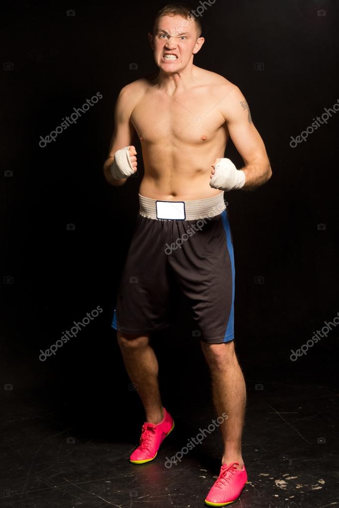 Young boxer gnashing his teeth at his opponent Stock Photo by ...