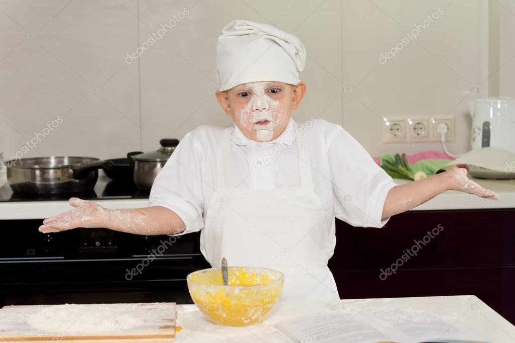 Young cook with a face full of flour shrugging Stock Photo by ...