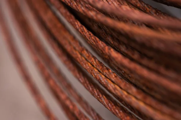 Round rusty steel wire coils. Metal reels for further industrial ...