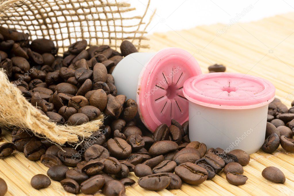 Capsules and coffee beans Stock Photo by ©ppi09 14683301