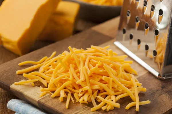 Shredded cheddar cheese Stock Photos, Royalty Free Shredded cheddar ...