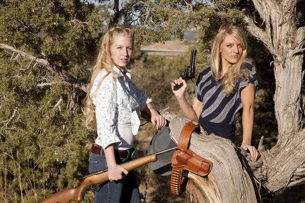 women by tree with guns - Stock Image - Everypixel