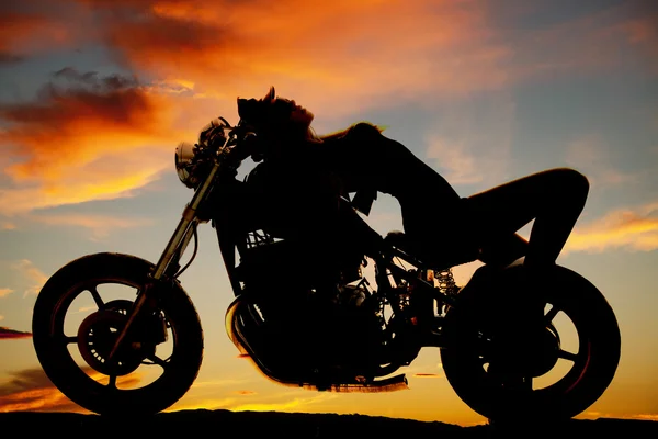 woman lay on back of motorcycle silhouette - Stock Image - Everypixel