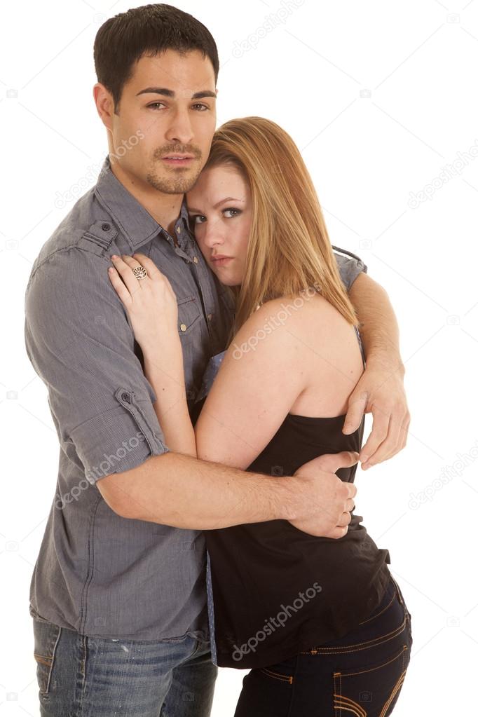 Mans arms around woman both looking — Stock Photo © alanpoulson #38552601