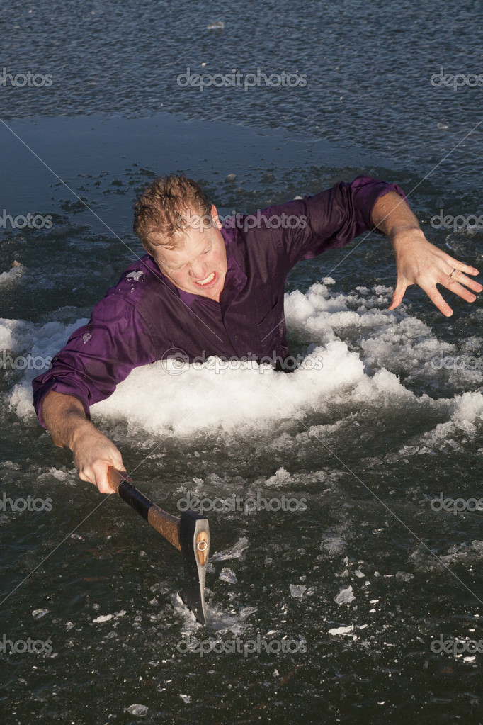 Man in ice hole axe intense — Stock Photo © alanpoulson #38740315