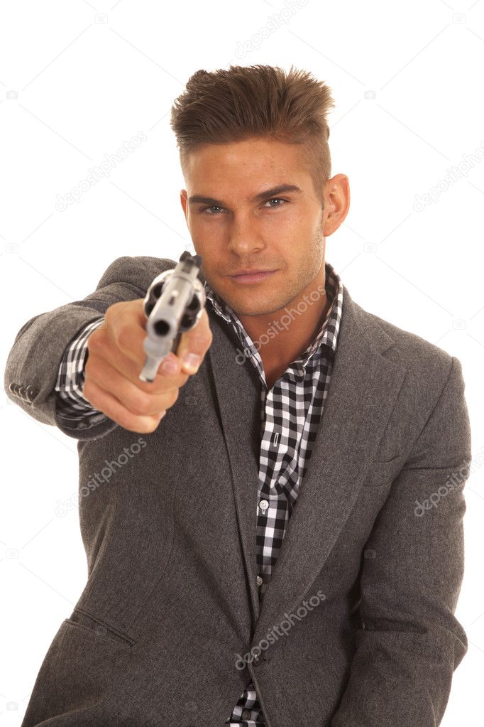 Serious man in suit pointing a revolver — Stock Photo © alanpoulson ...
