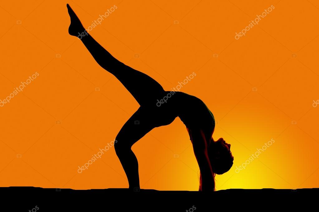 Silhouette of woman dancing back bend one leg up — Stock Photo ...