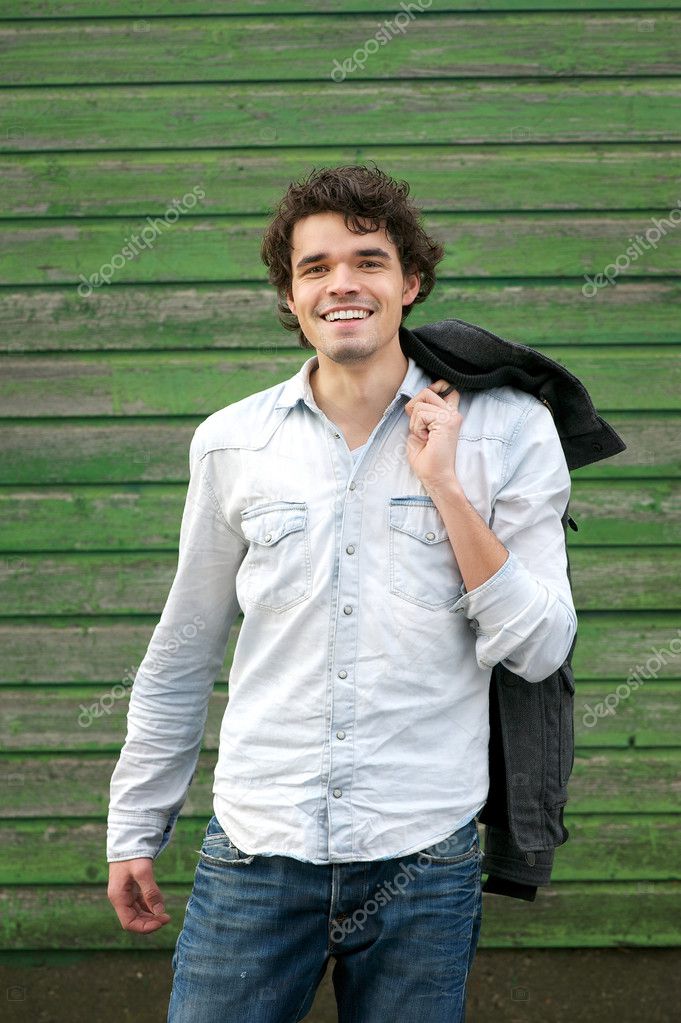 Handsome Guy Holding Jacket Outdoors Stock Photo by ©mimagephotos 18525339