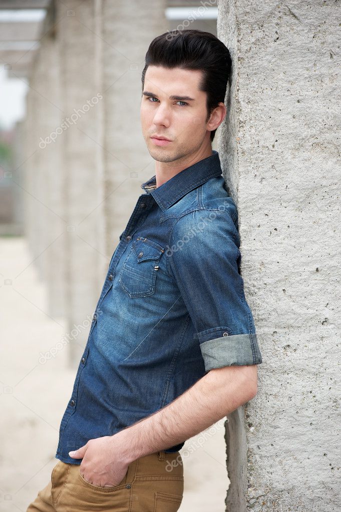 Male fashion model standing outdoors Stock Photo by ©mimagephotos 25838847