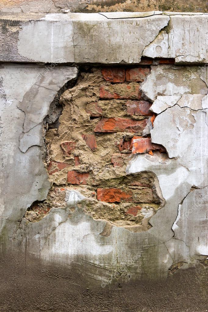 Brick through cracks and fissures Stock Photo by ©pellinni 23585711
