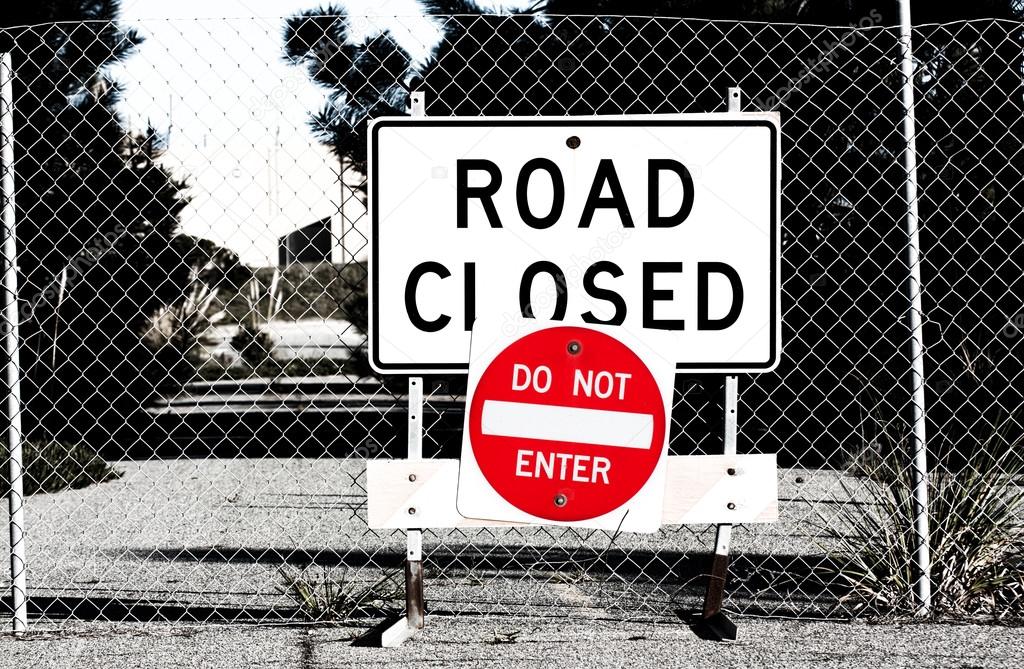 Road Closed Sign Before Chain Link Fence Stock Photo by ©wolterke 18912943