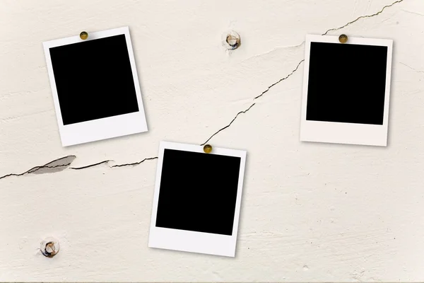 Polaroid films on damaged wall — Stock Photo © smithore #13380053