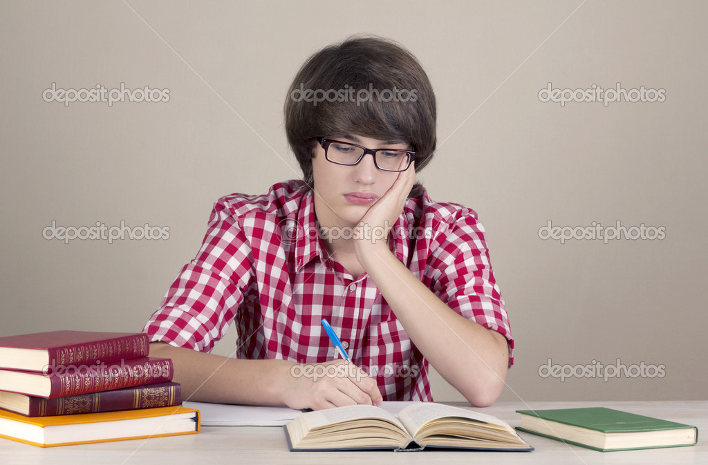 Nerd Schoolboy Studies His Homework Stock Photo by ©Natasan 20350393