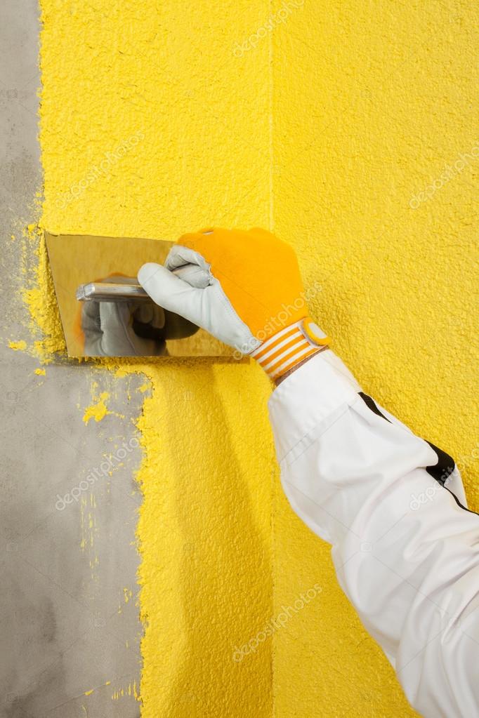 A trowel spreading a plaster on a corner-wall — Stock Photo ...