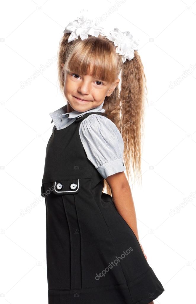 Little girl in school uniform Stock Photo by ©VaLiza 18921375