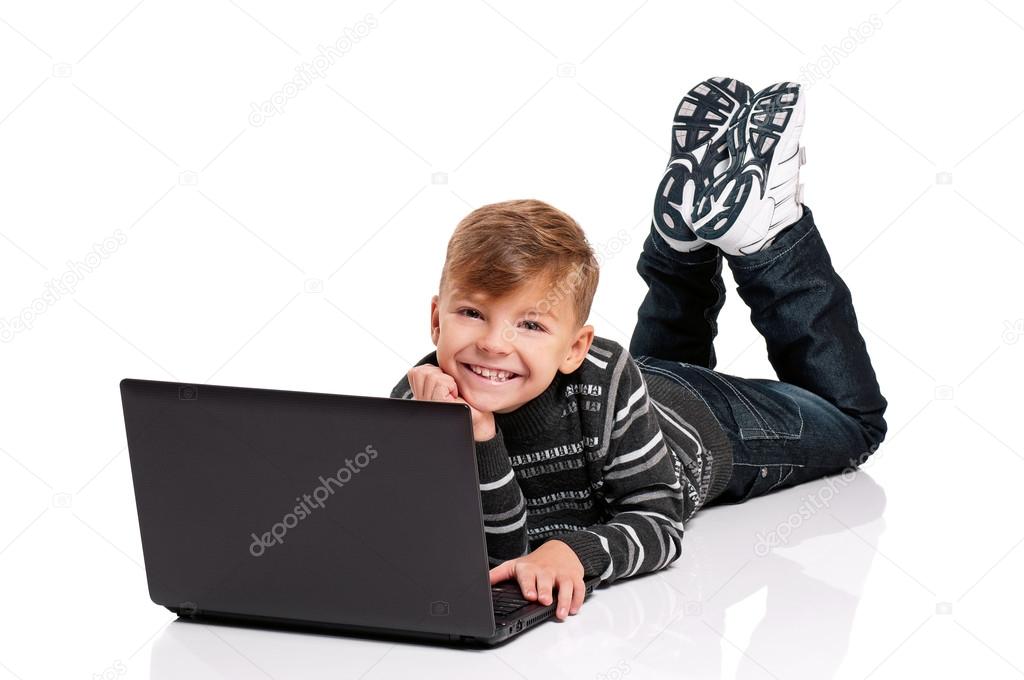 Boy with laptop ⬇ Stock Photo, Image by © VaLiza #19737121