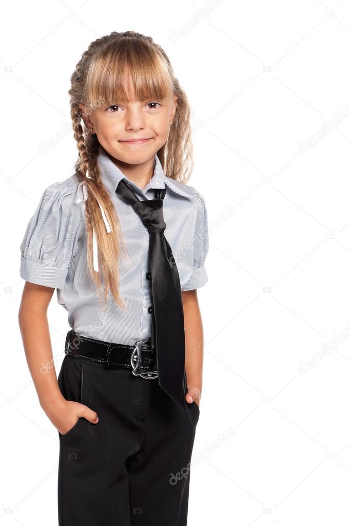 Little girl in school uniform Stock Photo by ©VaLiza 30324739