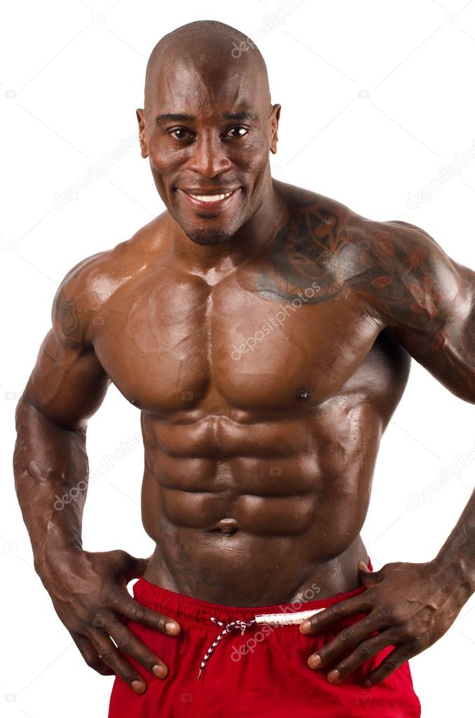 Confident black bodybuilder smiling.Strong man with perfect muscles ...