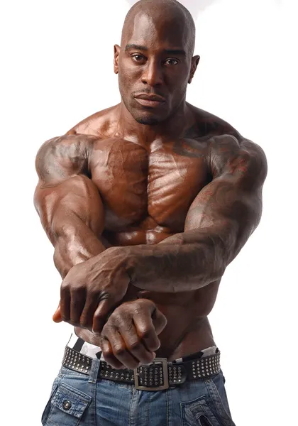 Black bodybuilder training with dumbbells. Strong man with perfect abs ...